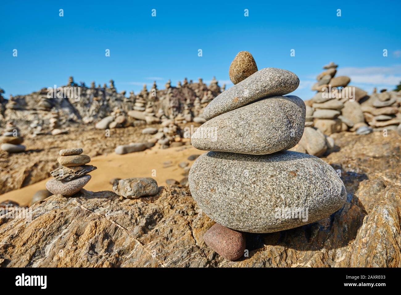 Stones, cairn at the beach, between Cairns and Port Douglas in spring ...