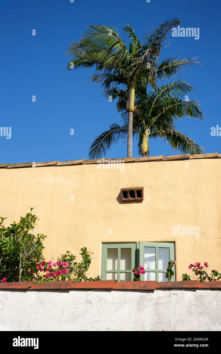 Typical California home with painted plaster exterior, a garden wall ...