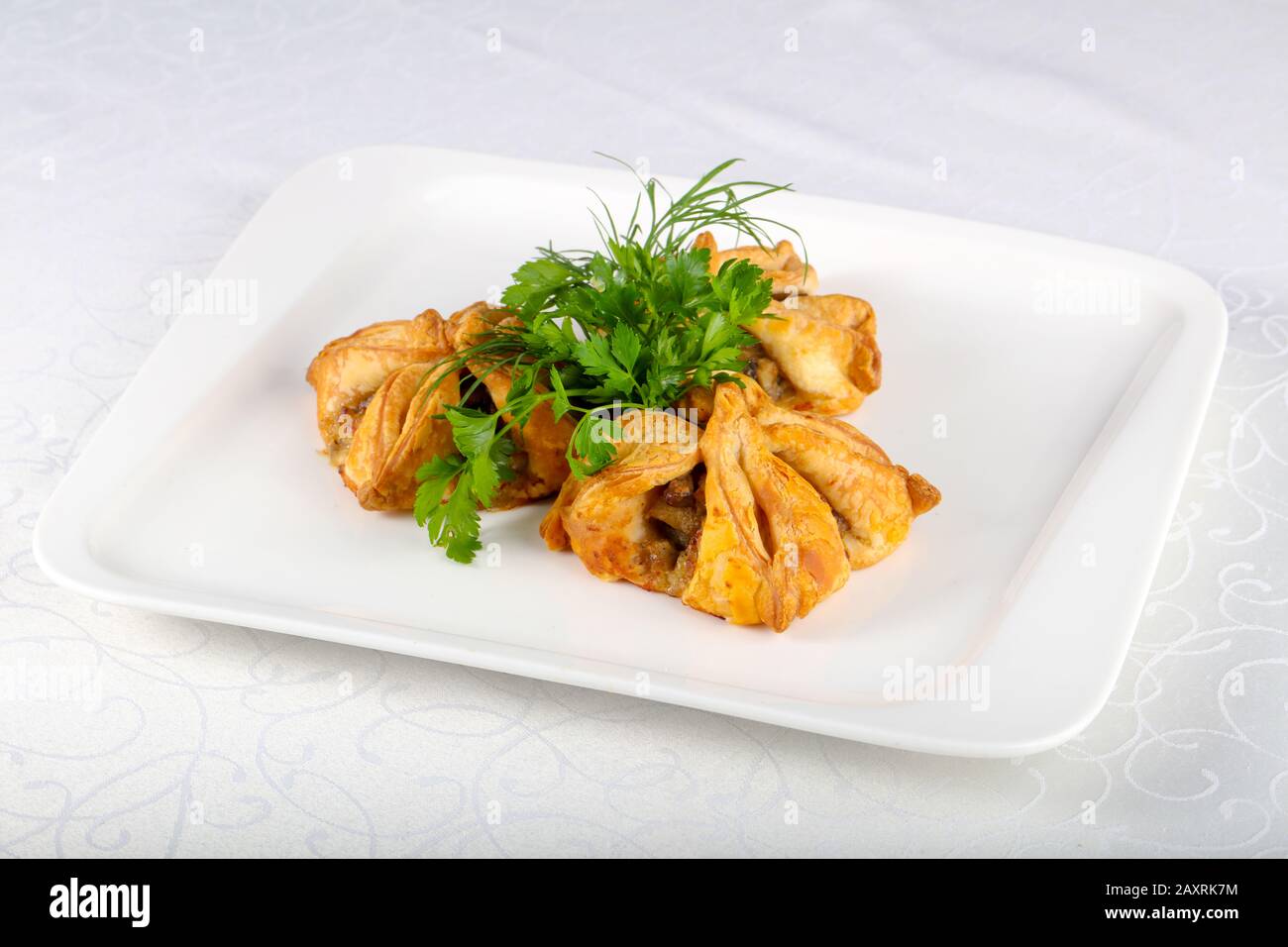Pastry with meat served parsley Stock Photo - Alamy