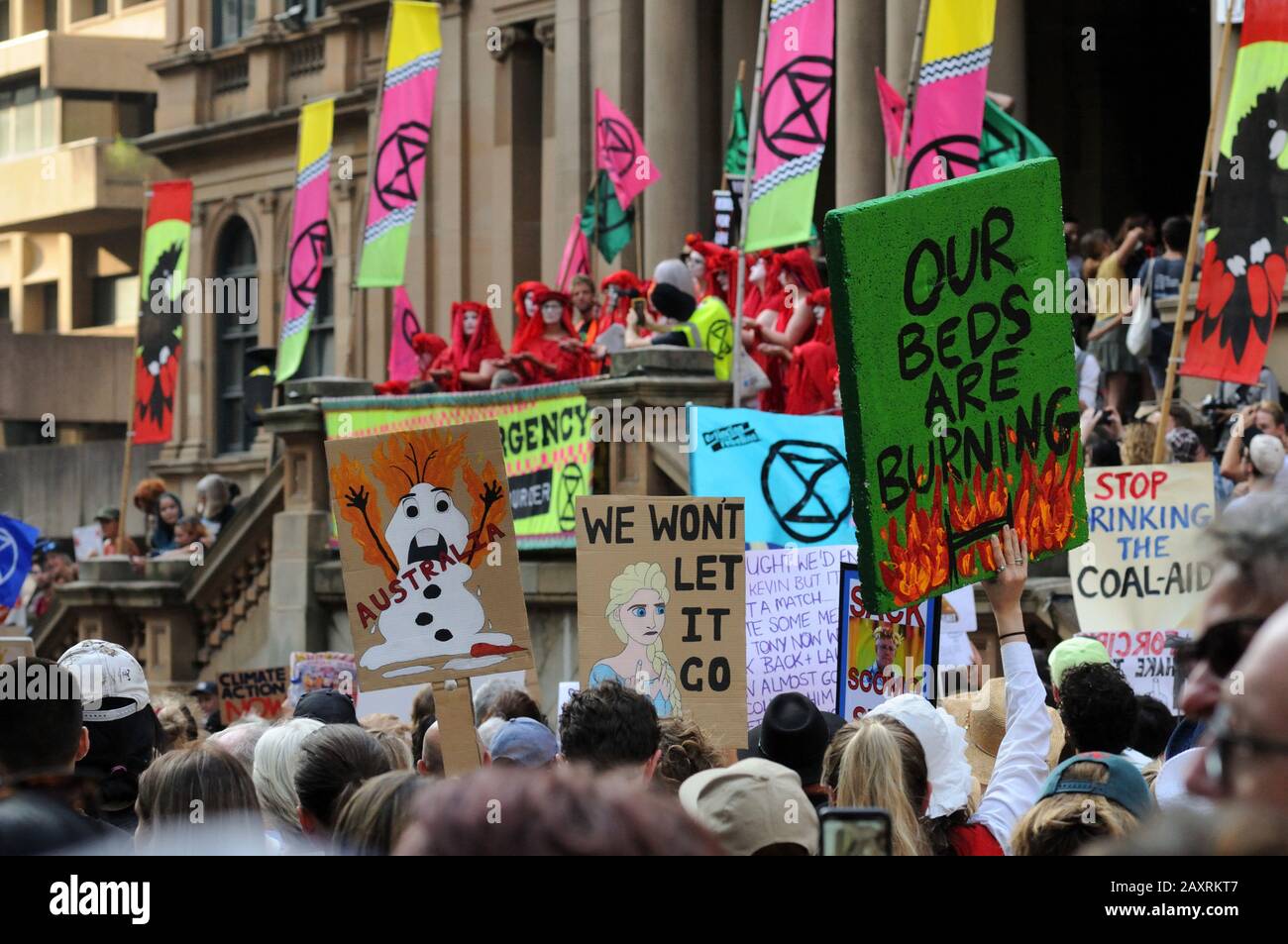 The Red costumes and white faces of Extinction Rebellion protesters ...