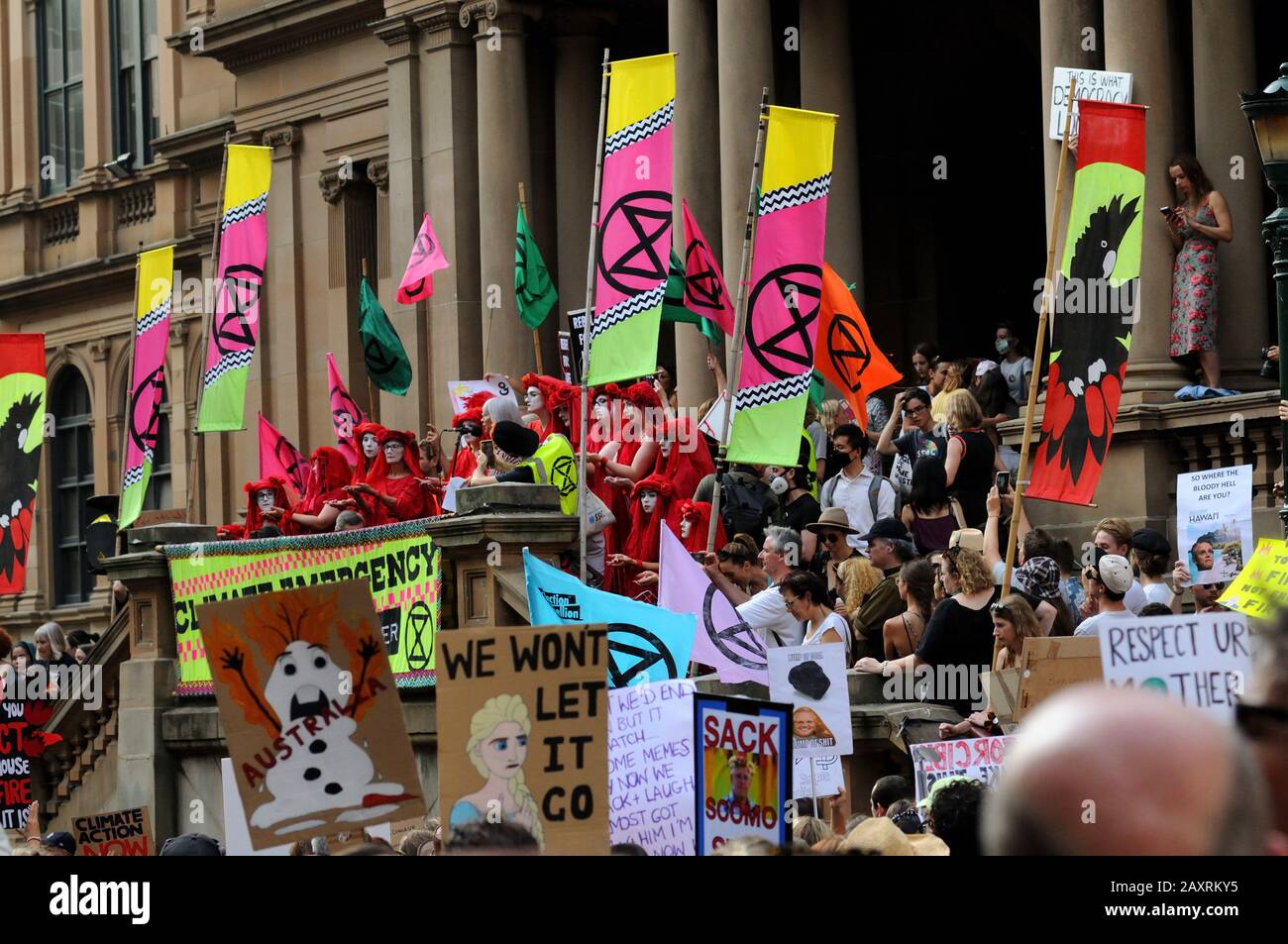 The Red costumes and white faces of Extinction Rebellion protesters ...