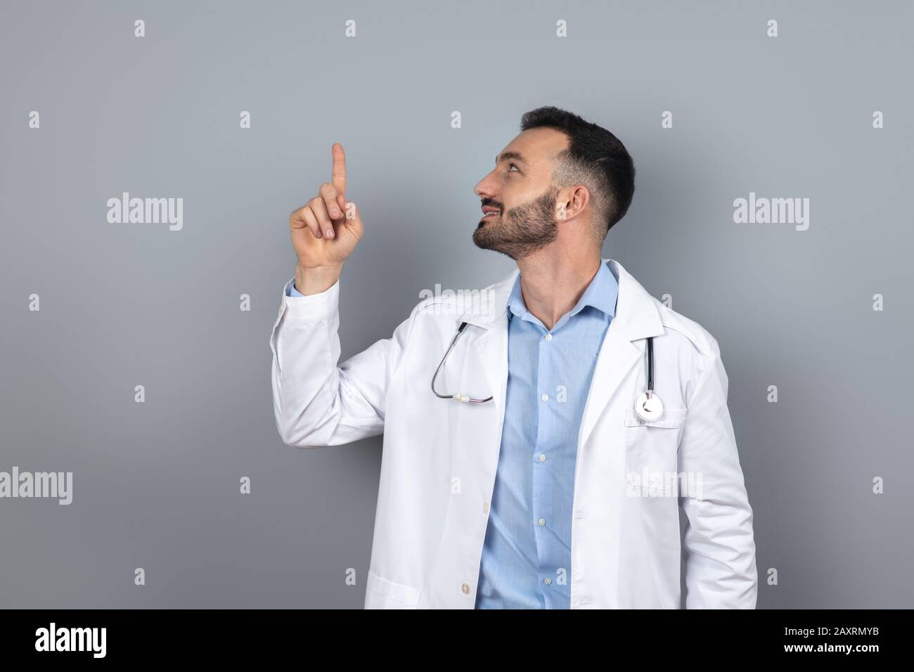 Doctor pointing something in hi-res stock photography and images - Alamy