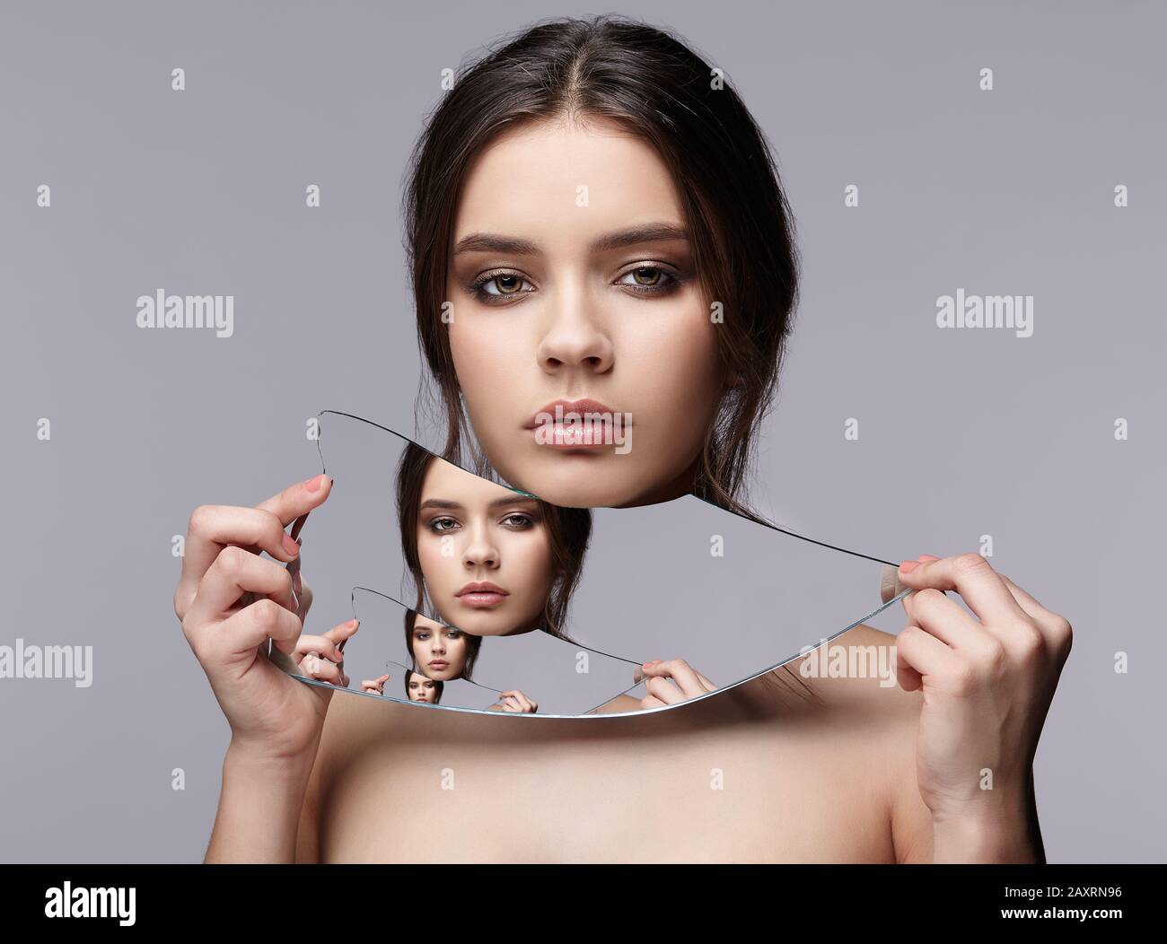 Girl with a shard of the mirror. Female with mirror shard in hand ...