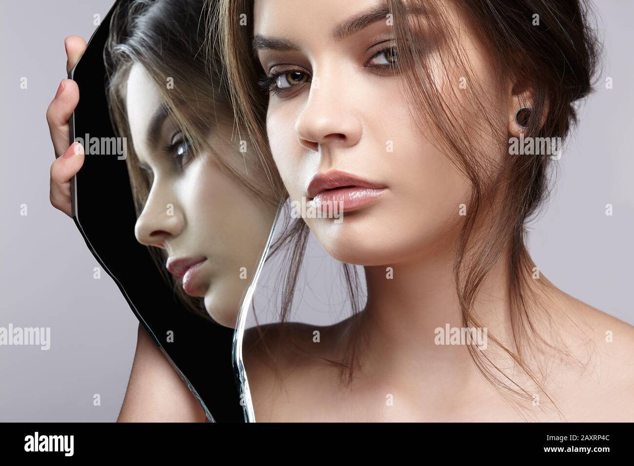 Girl with a shard of the mirror. Female with mirror shard in hand ...