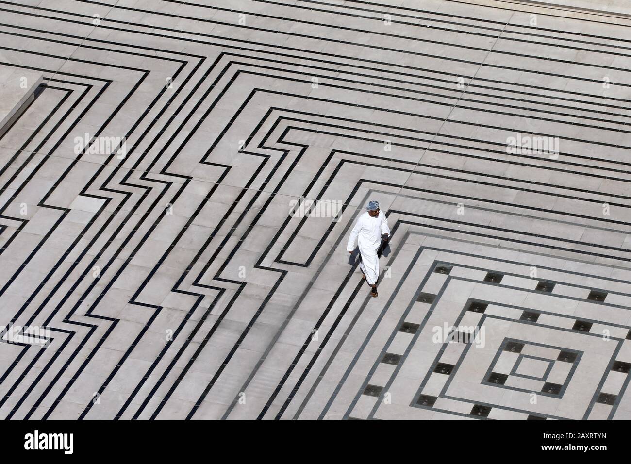 Muscat / Oman – February 13, 2020: A local man walks across Al Marsa ...