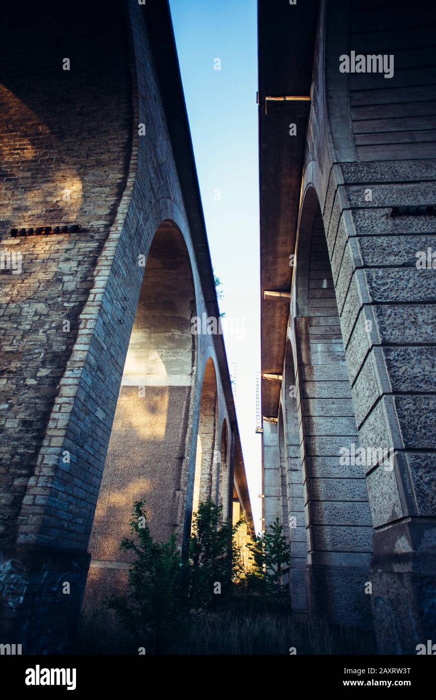 Historic arch bridge over valley Stock Photo - Alamy