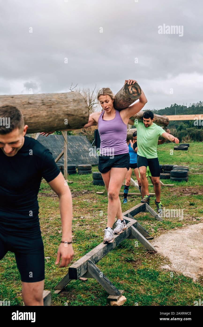 Men carrying log hi-res stock photography and images - Alamy