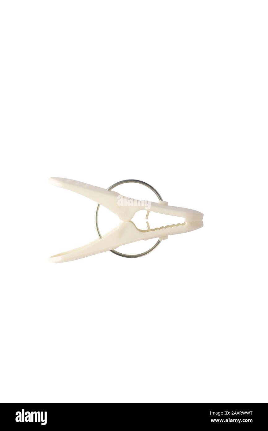 white plastic clothespin isolated on white background Stock Photo - Alamy
