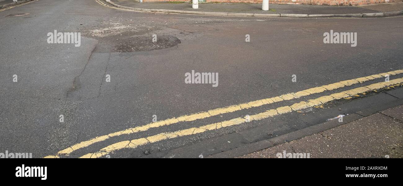 Pot hole on a road surface Stock Photo - Alamy