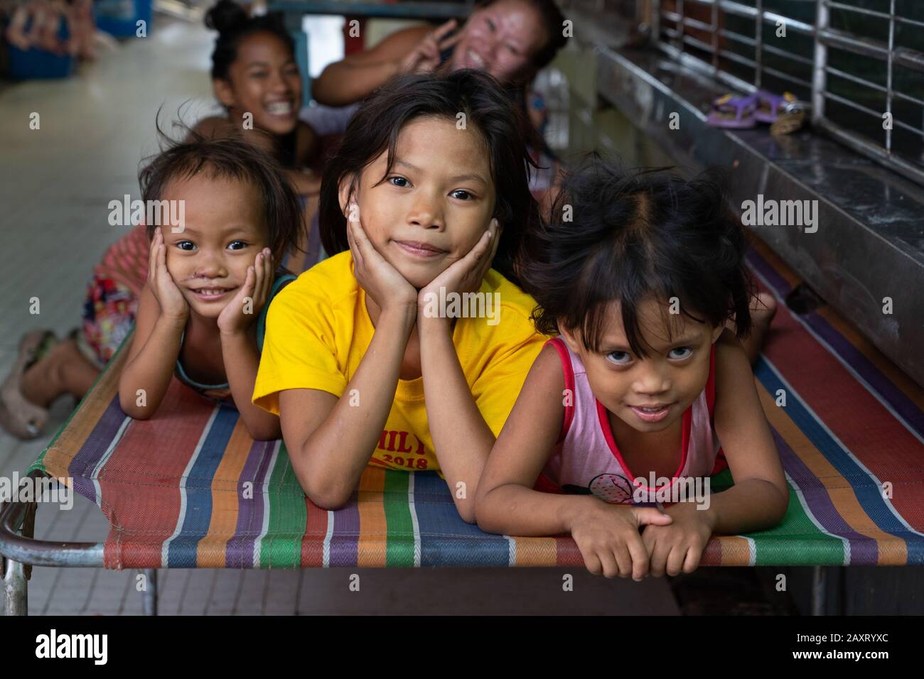 Young Filipino children pose for a photograph in a market within Cebu ...