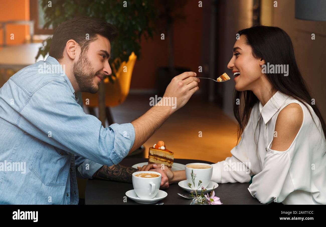 Beautiful couple young lovers feeding hi-res stock photography and ...