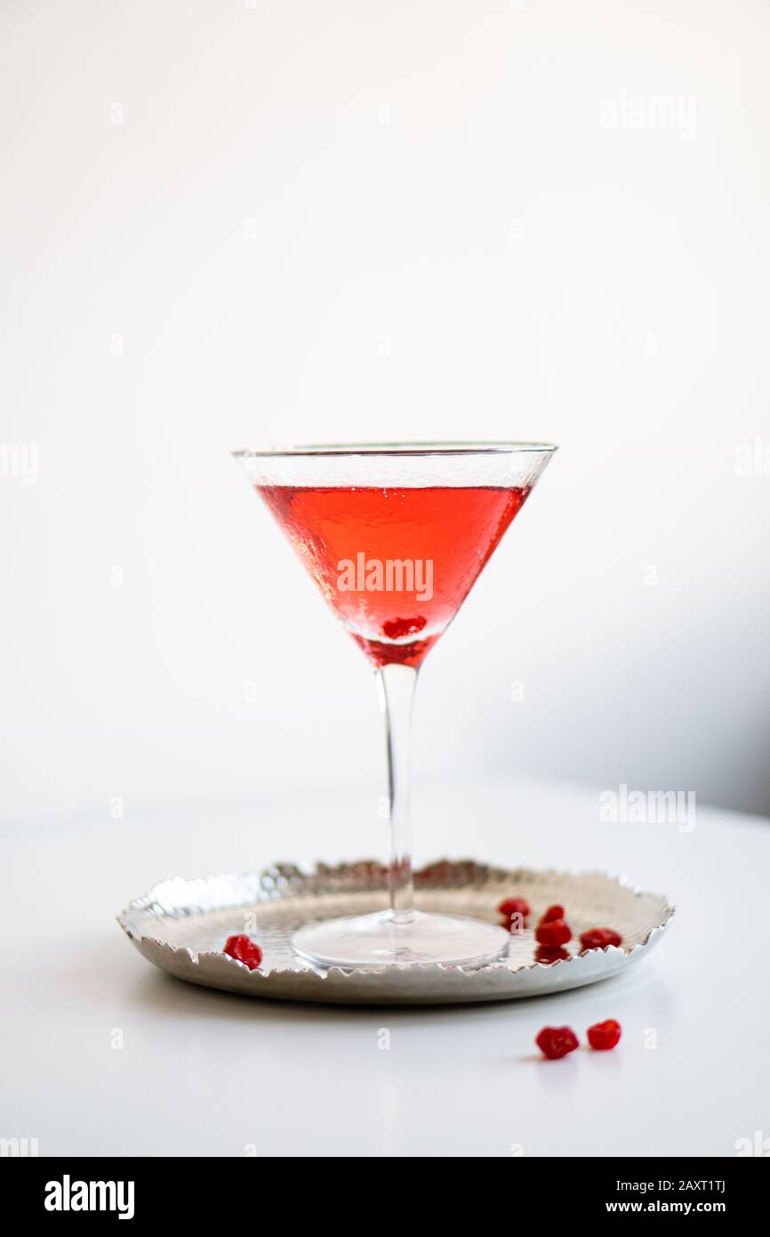 Classic red cocktail in crystal texture glass on white background Stock ...