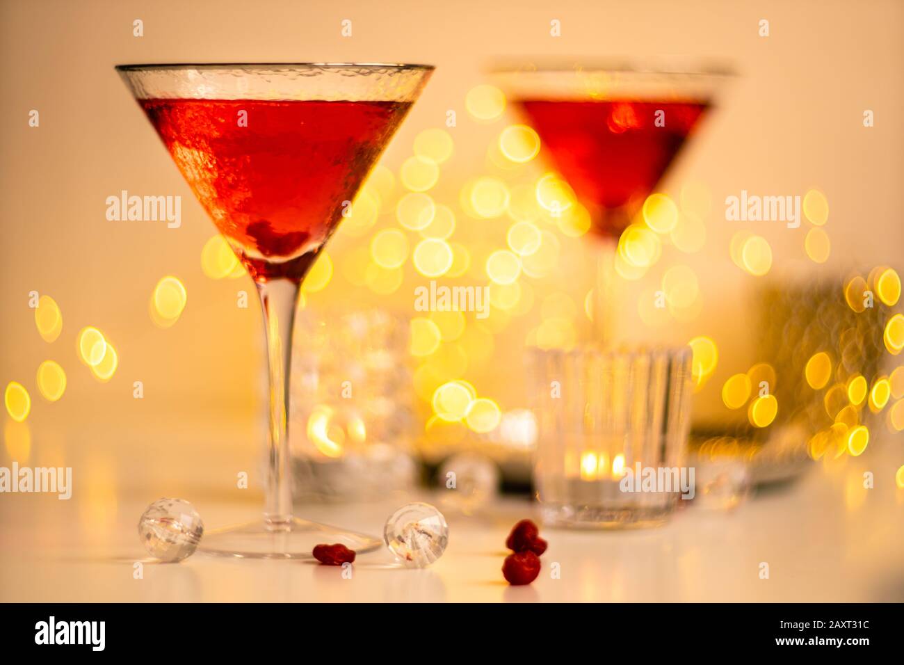 Classic red cocktail in fancy texture glass on bright light bokeh ...