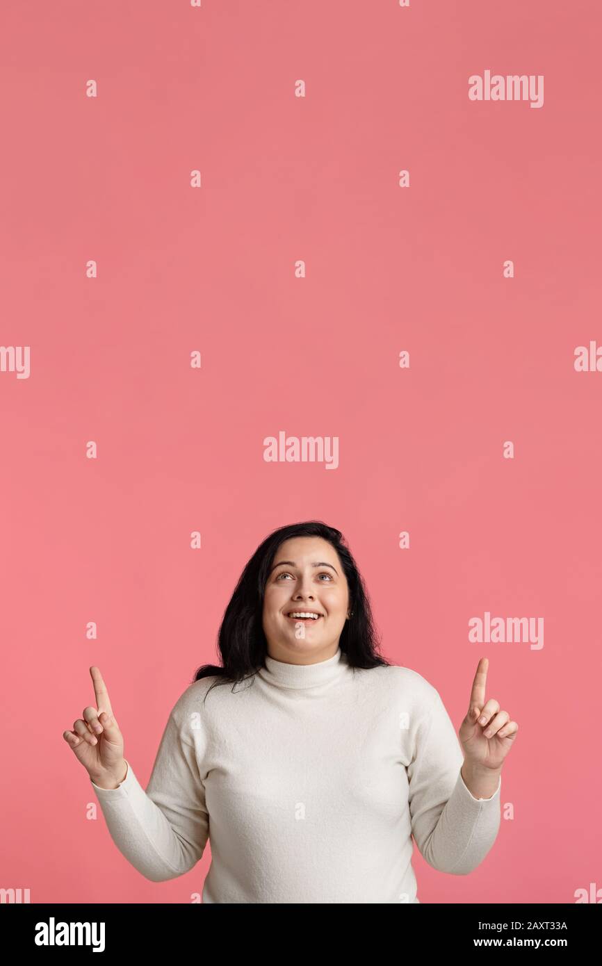 Positive Overweight Girl Pointing Fingers Upward Standing Over Pink ...