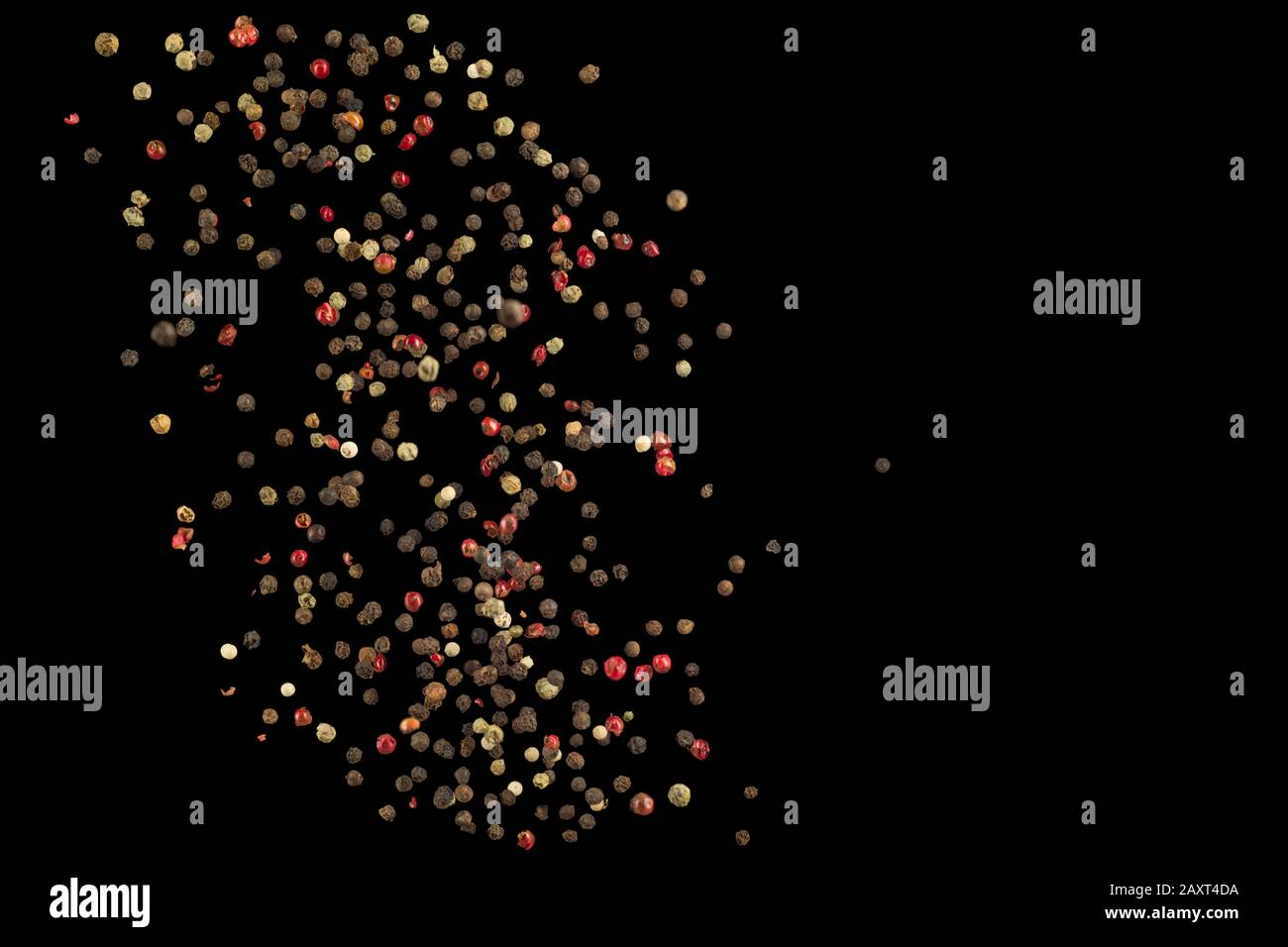 Whole coloured pepper spice flying in the air close up. Zero gravity ...