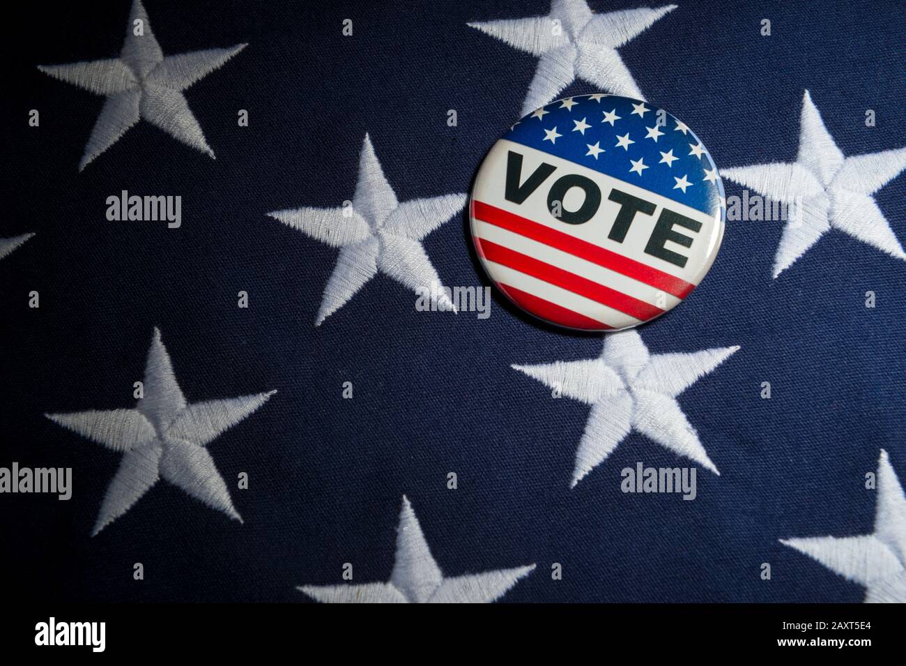 Vote political election pin sitting on thick textured American flag ...