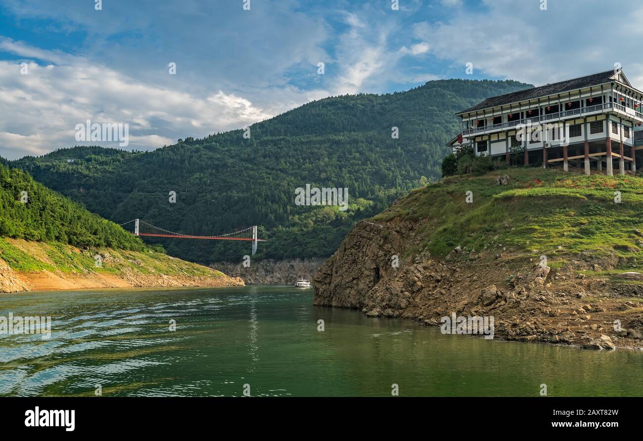 Bridge over the Shennong Xi Stream and building where local cultural ...