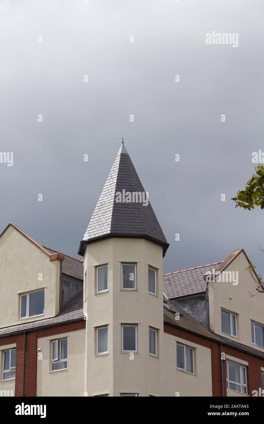Multi storey Building, white rendered wall and red brick,octagonal grey ...