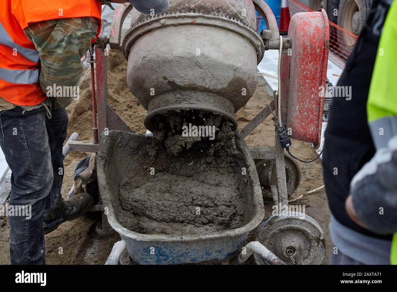 workers makes concrete with machine Stock Photo - Alamy