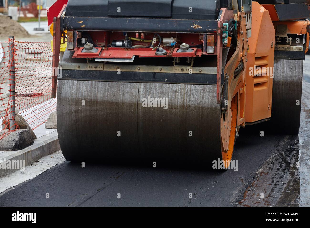 Industrial heavy machine working on road construction Stock Photo - Alamy
