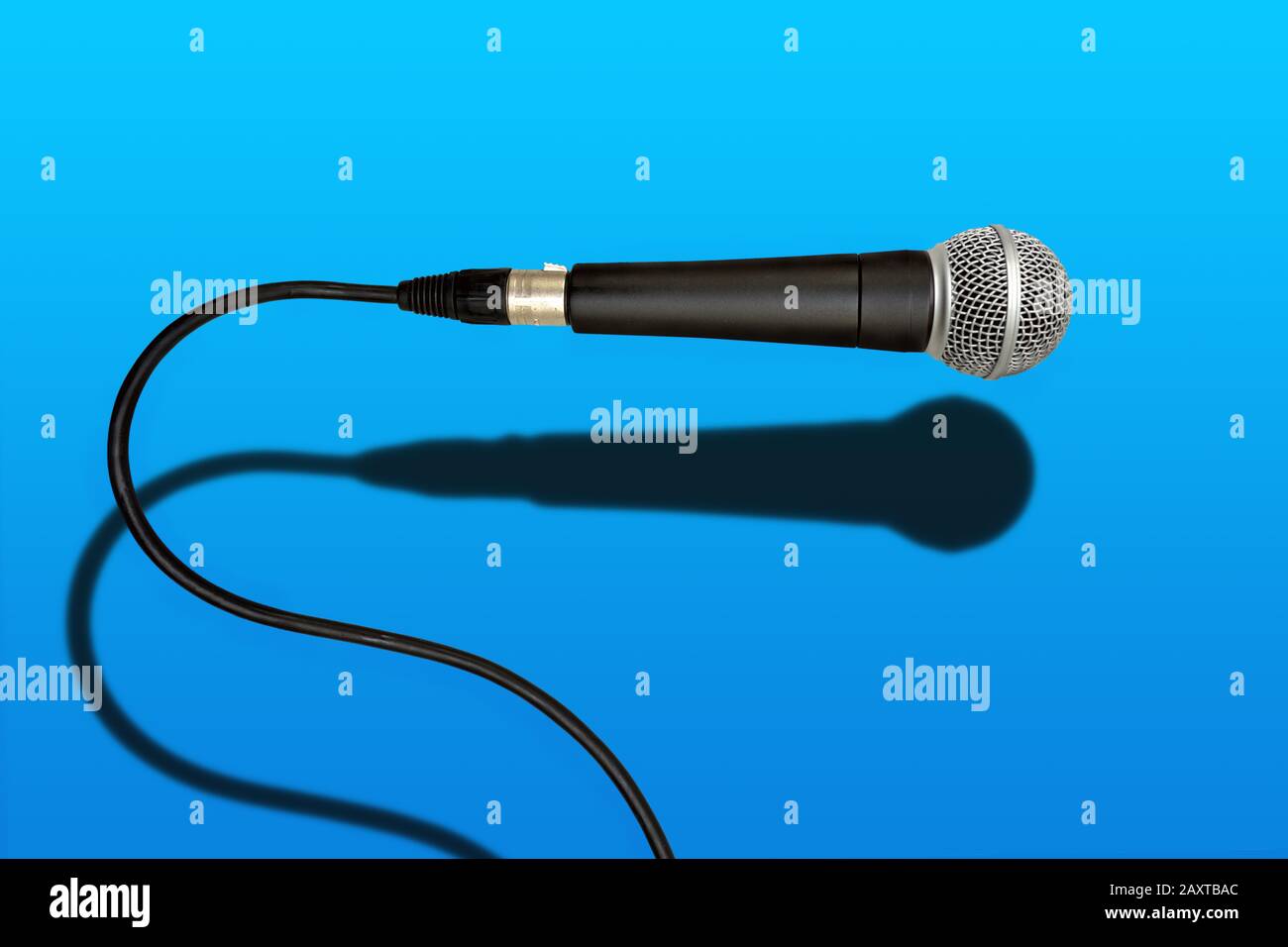 wired singer black and grey microphone on red lava color background ...