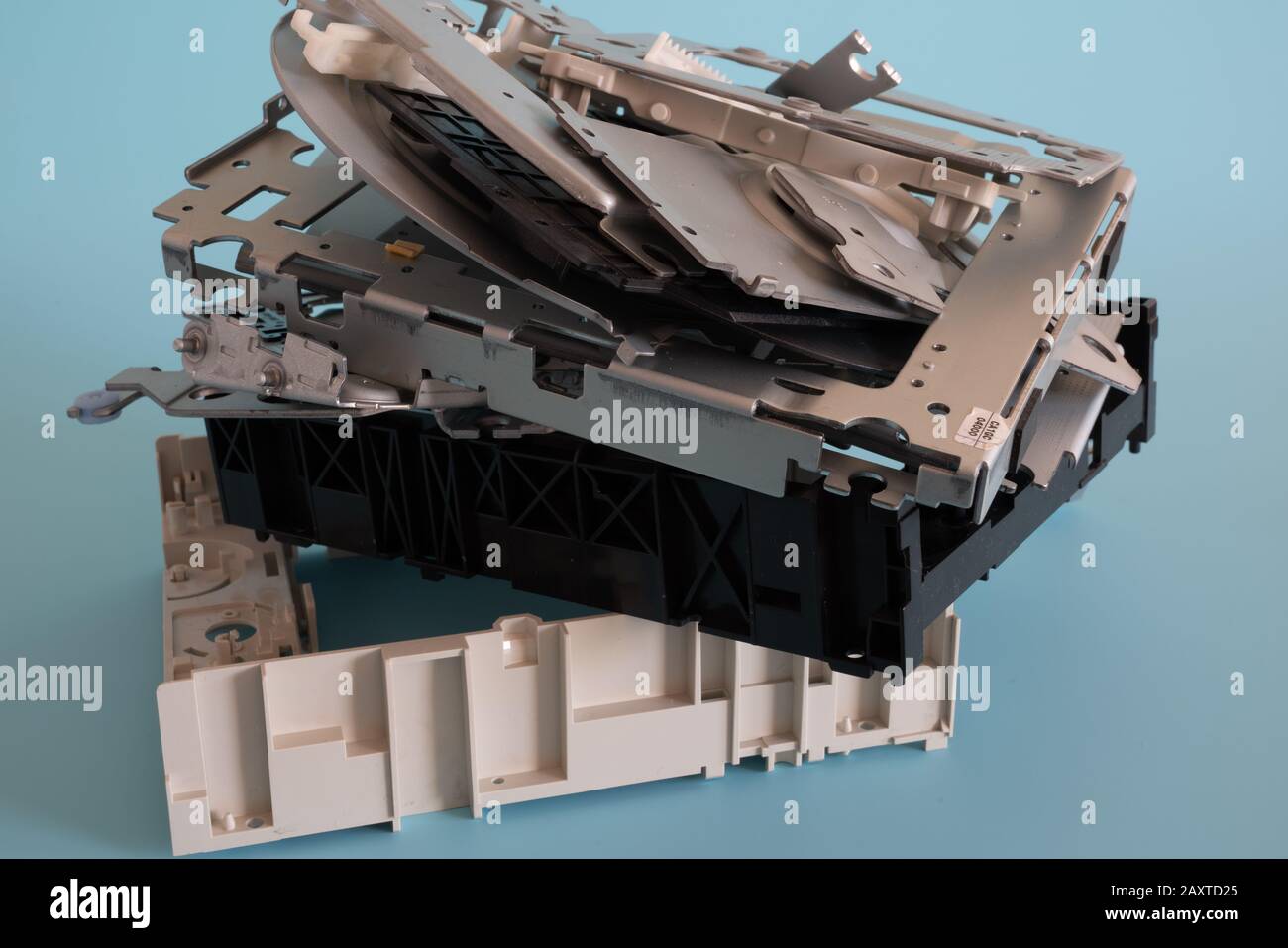 Old disassembled computer DVD drive for recycle on blue background ...