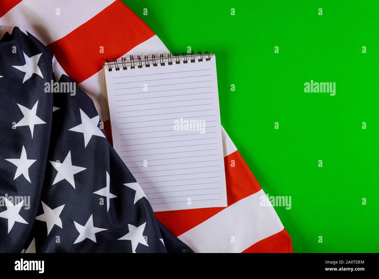 Opened spiral notepad on Beautifully ruffled American flag for ...