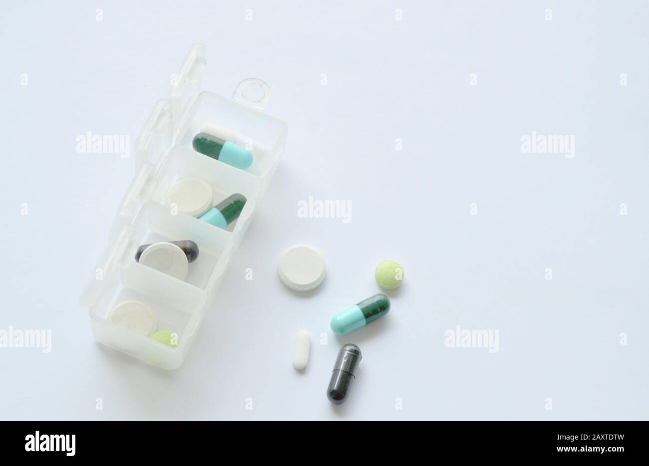 medical capsule and drugs in plastic box background Stock Photo - Alamy