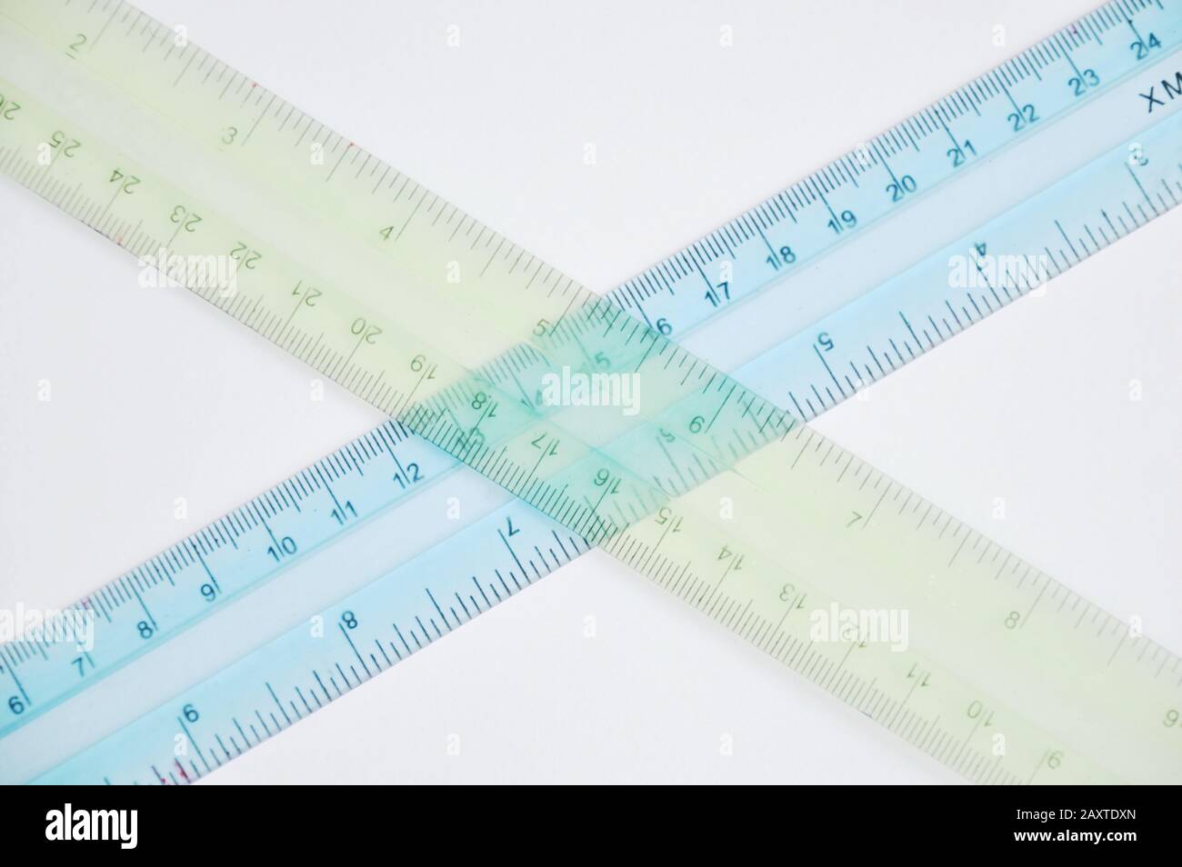 colorful plastic ruler crossing on white background Stock Photo - Alamy