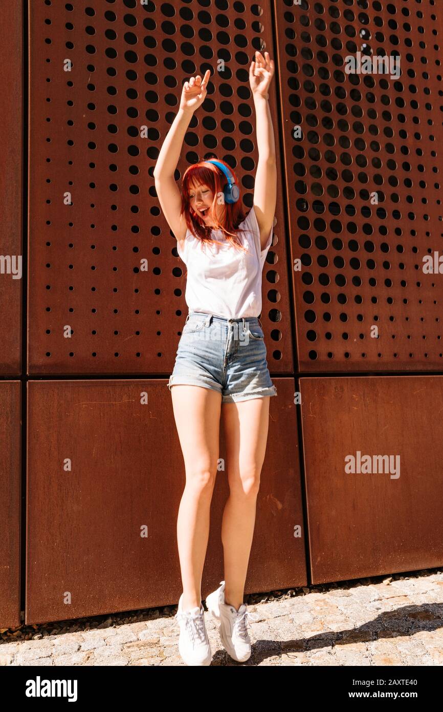 Young girl dancing on street and jumping high up Stock Photo - Alamy