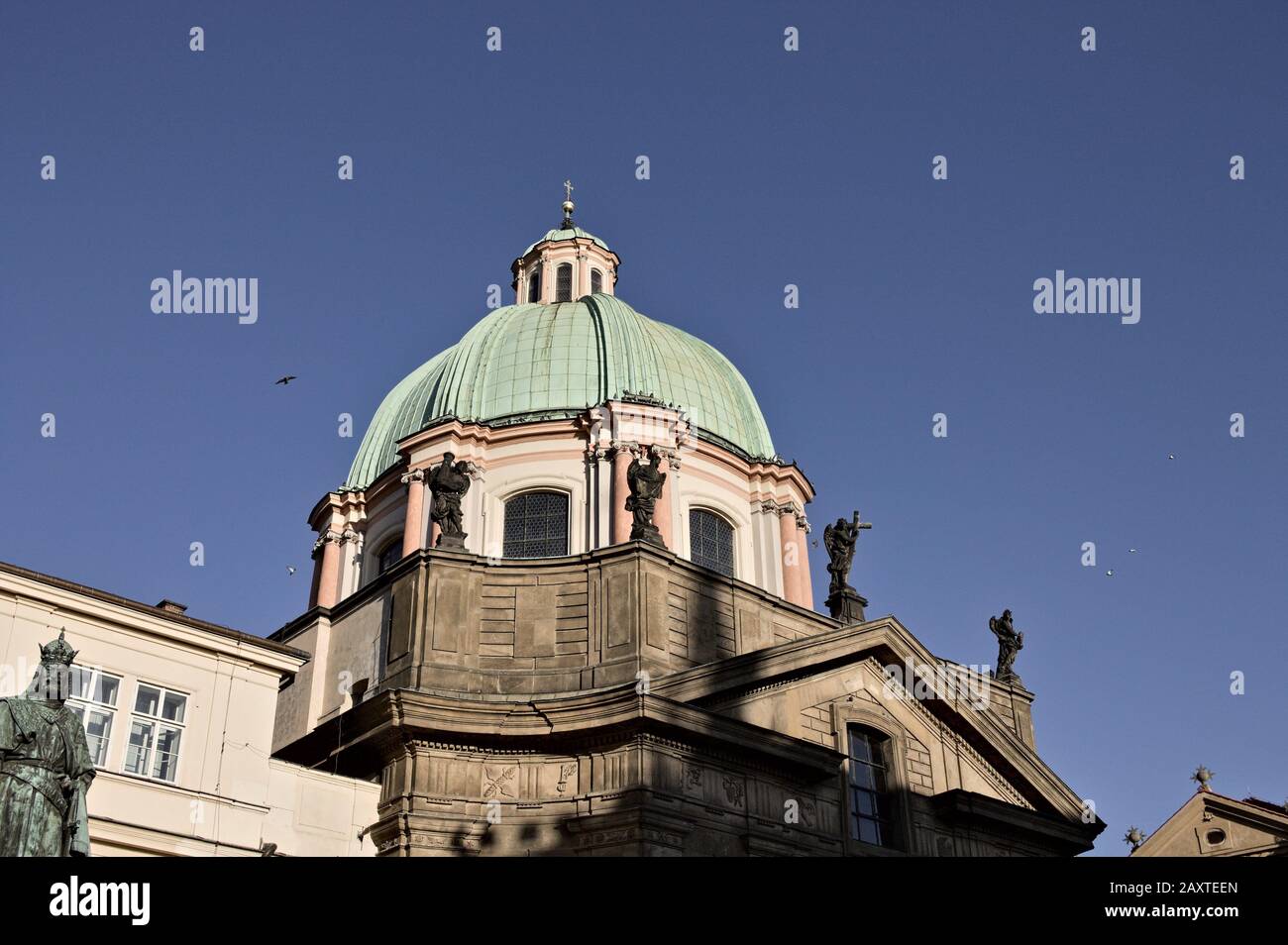 A green dome of an old baroque church with pink columns (Prague, Czech ...