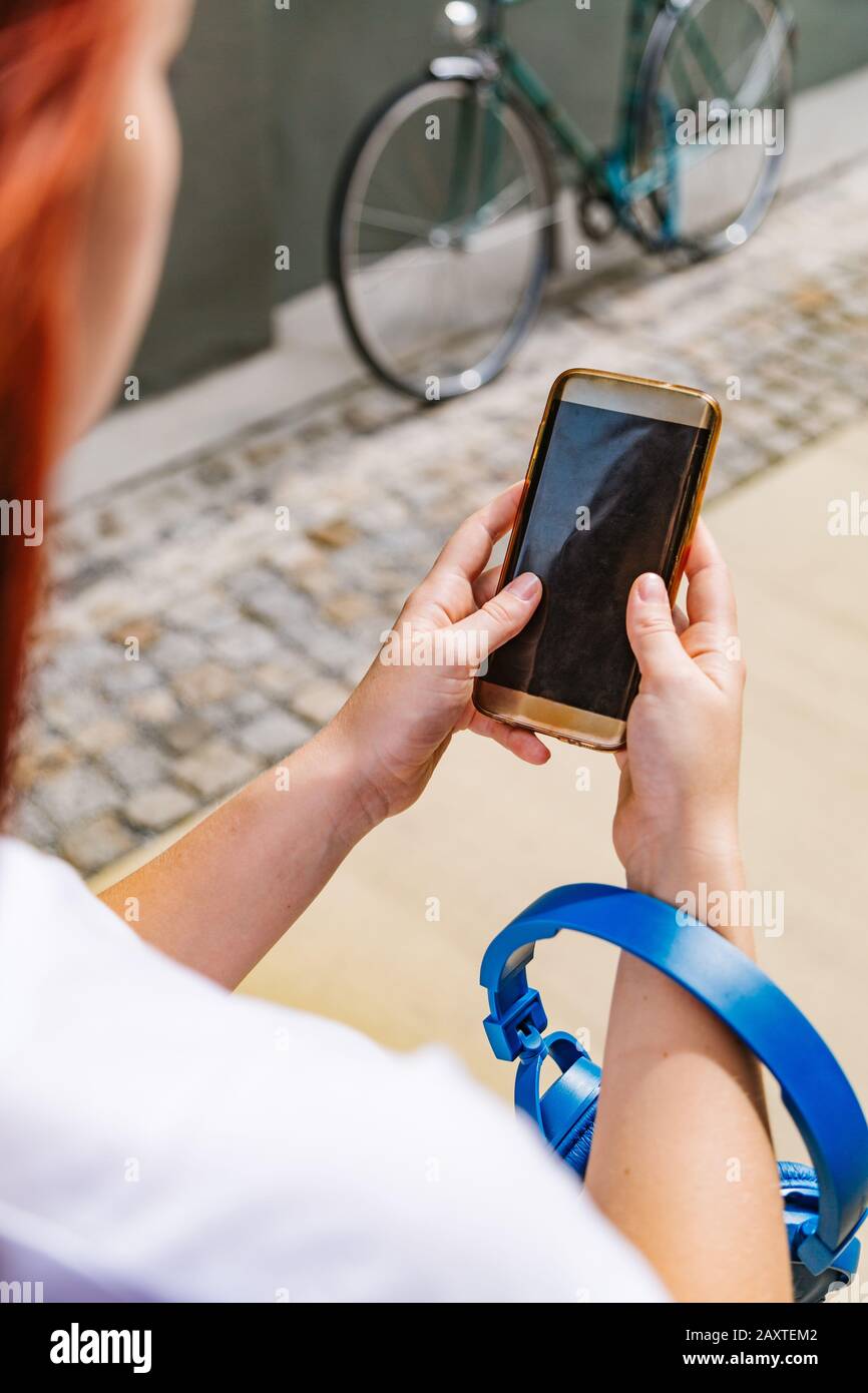 Woman's hands close up using mobile phone outdoor Stock Photo - Alamy