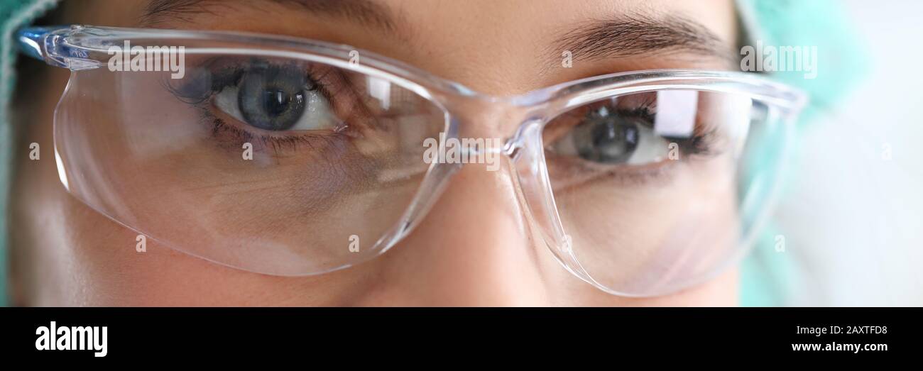 Medical doctor in protectine glasses look at camera Stock Photo - Alamy