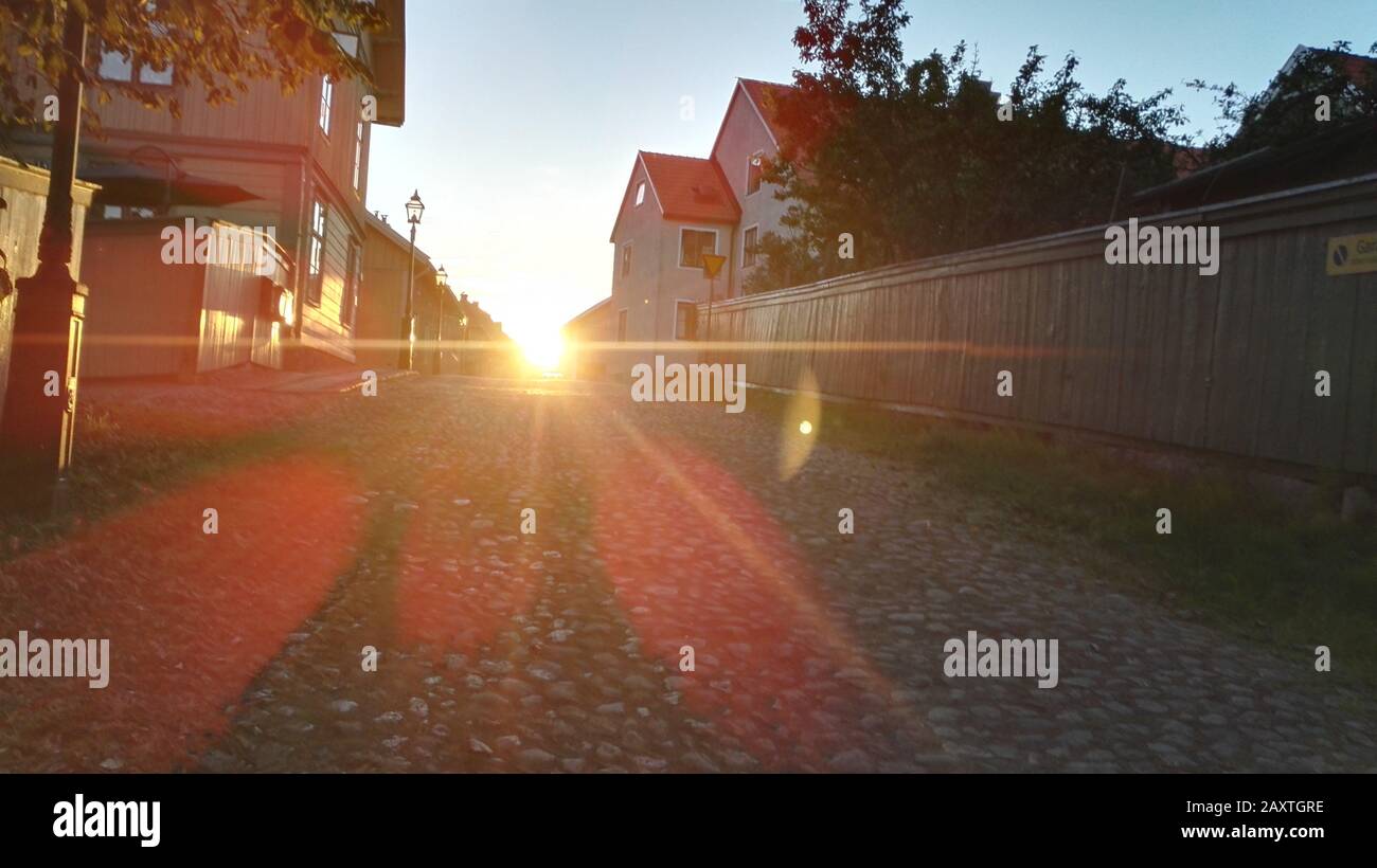 Beautiful low angle view sunset of cobblestone street, Sweden Stock ...