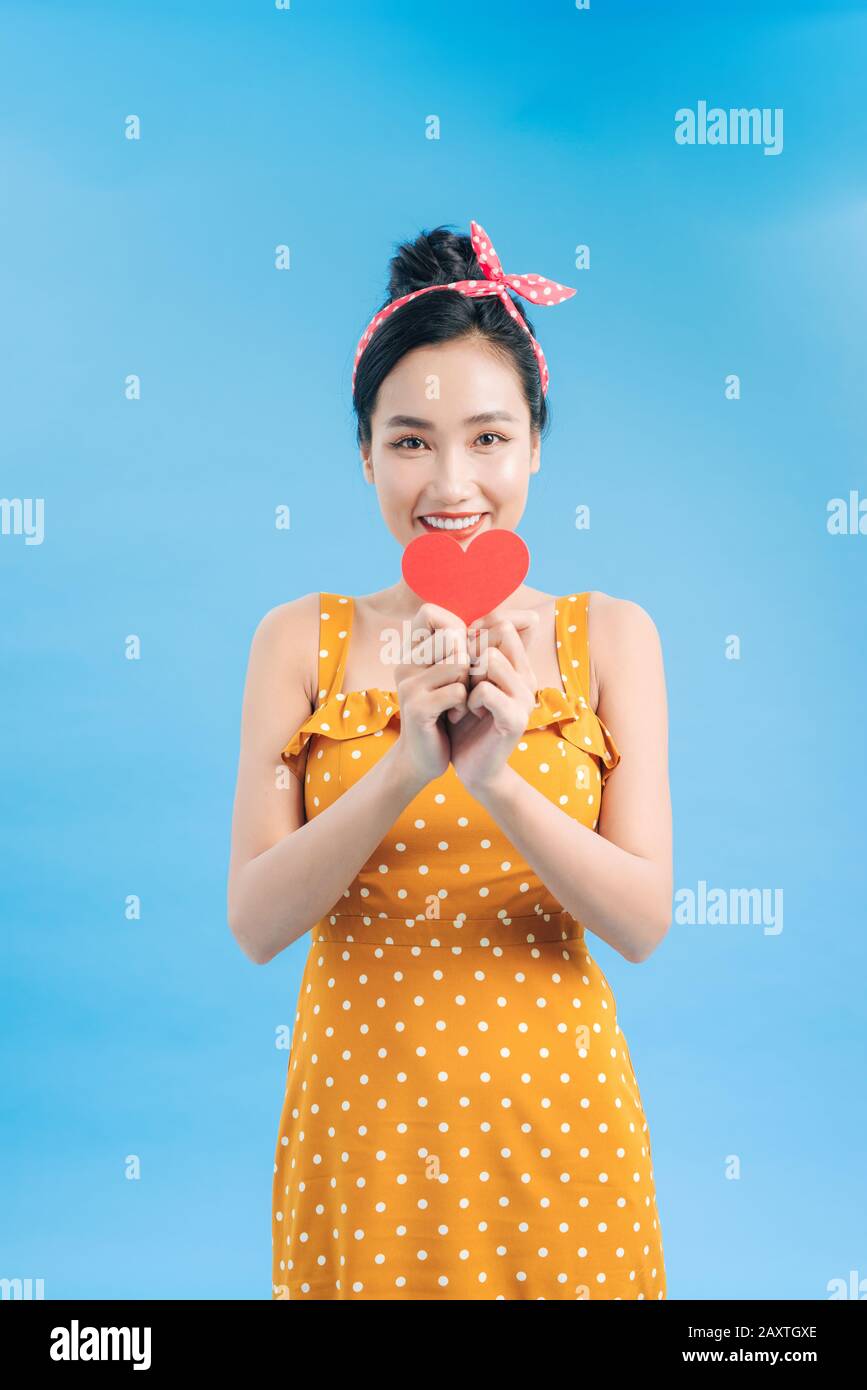 Bright clothes woman heart lovers day blue background Stock Photo - Alamy