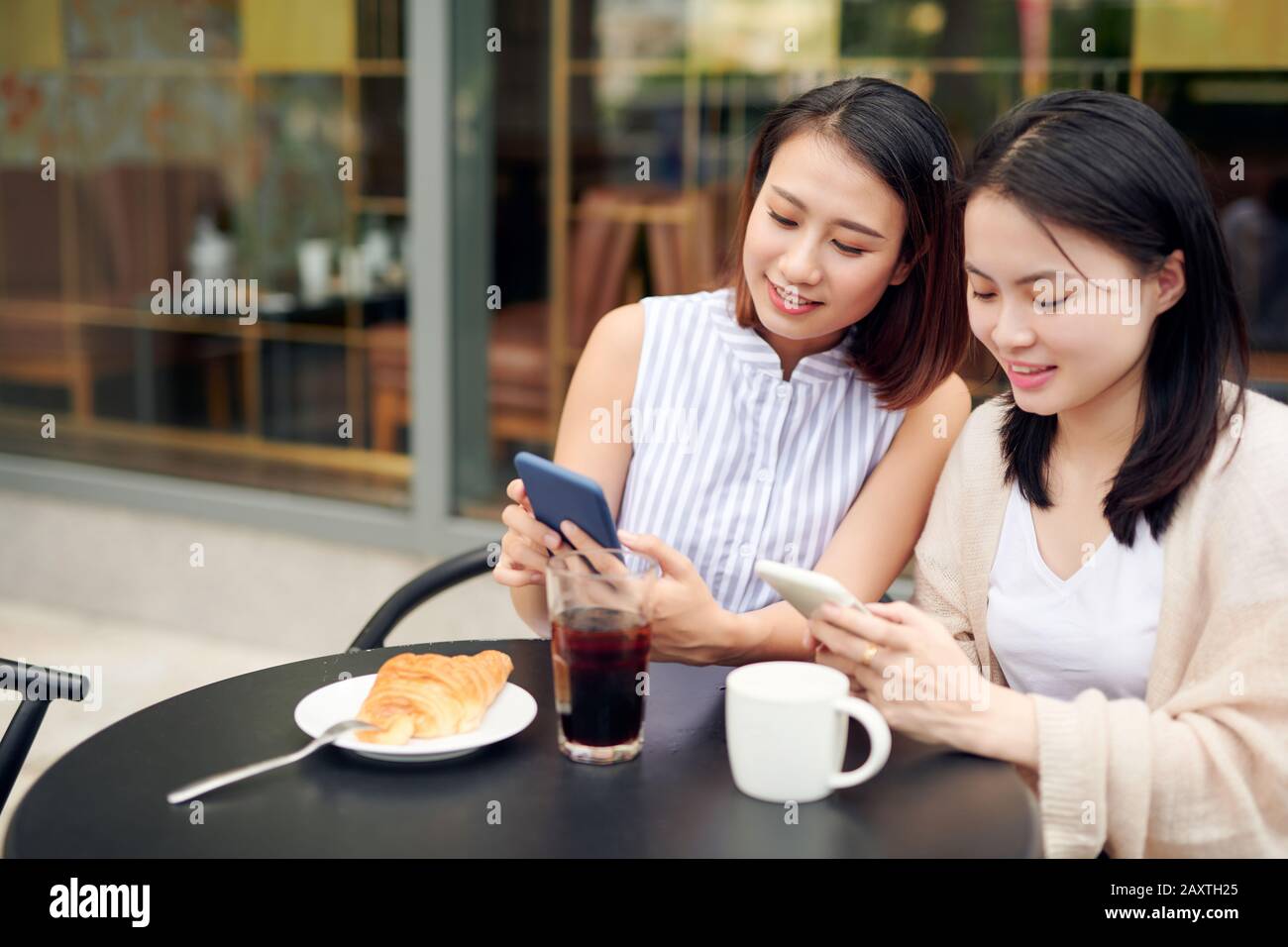 Two female friends meeting hi-res stock photography and images - Alamy