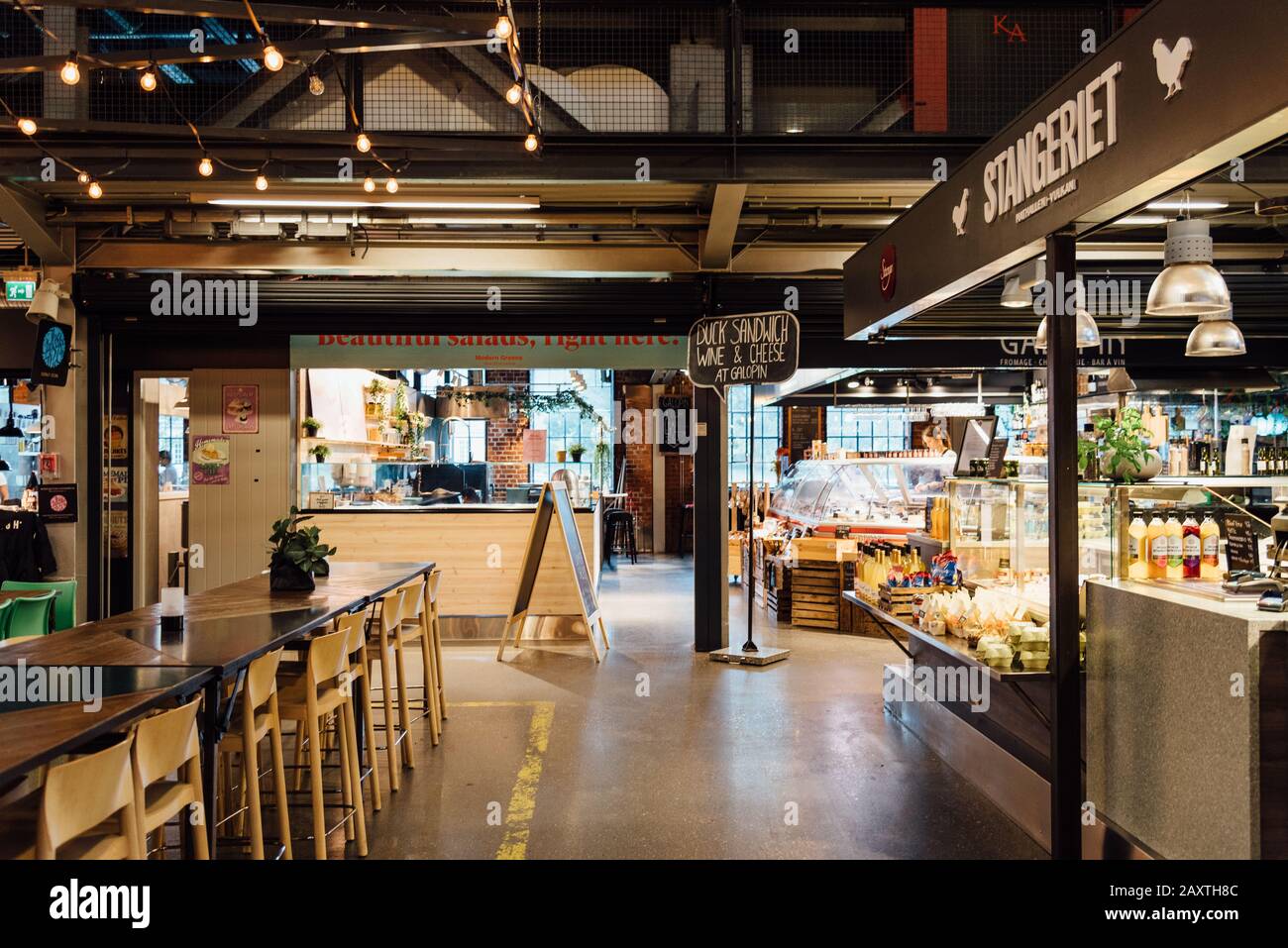 Oslo, Norway - August 11, 2019: View of Mathallen Oslo, a food market in Grunerlokka, with cafes ...