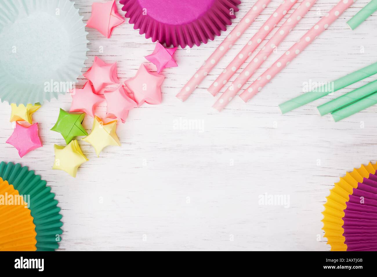 Bright paper decorations and straws on white background Stock Photo - Alamy