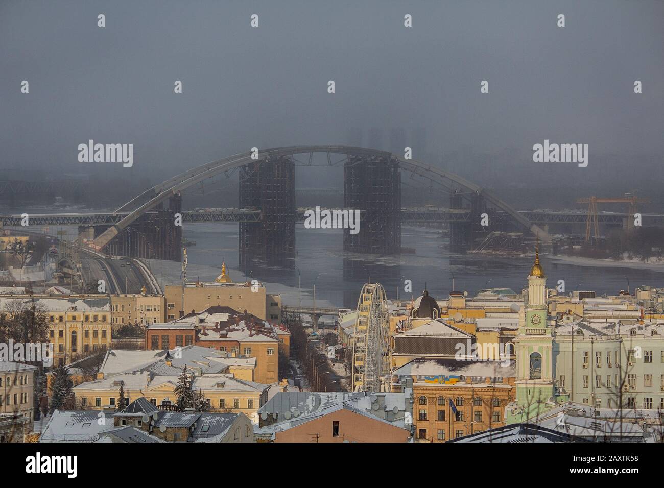 Unfinished Podilsko Voskresensky bridge in construction over a river ...