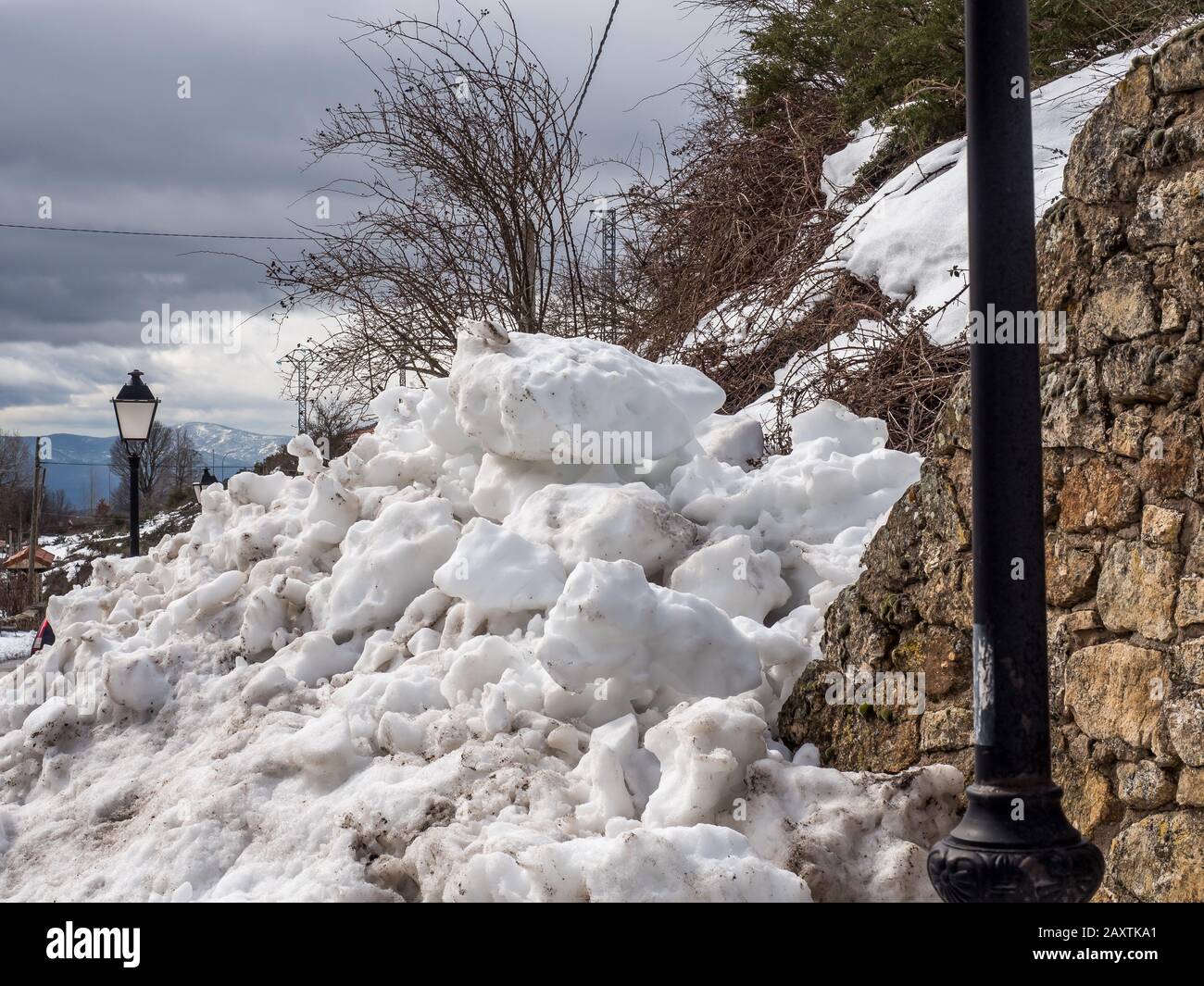 Winter in the spanish villages left snow on the streets Stock Photo - Alamy