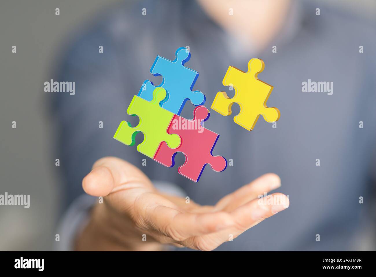 Person presenting a virtual projection of puzzles - business solution ...