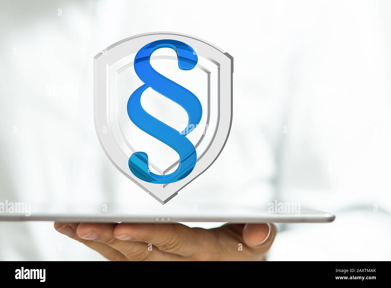 Person working with a digital paragraph law symbol Stock Photo - Alamy