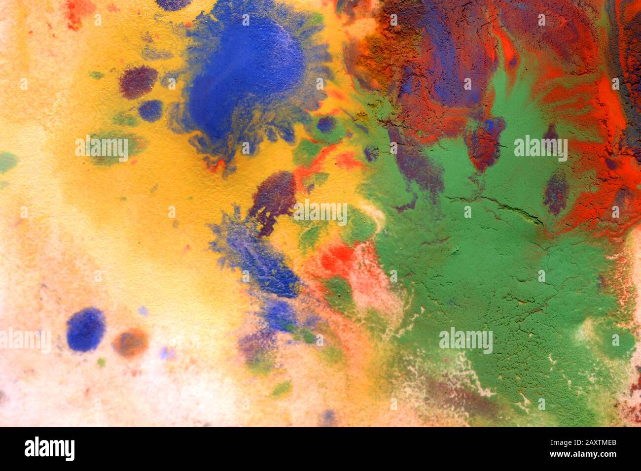 Mixing of paints of different colors on a white paper. Abstract ...