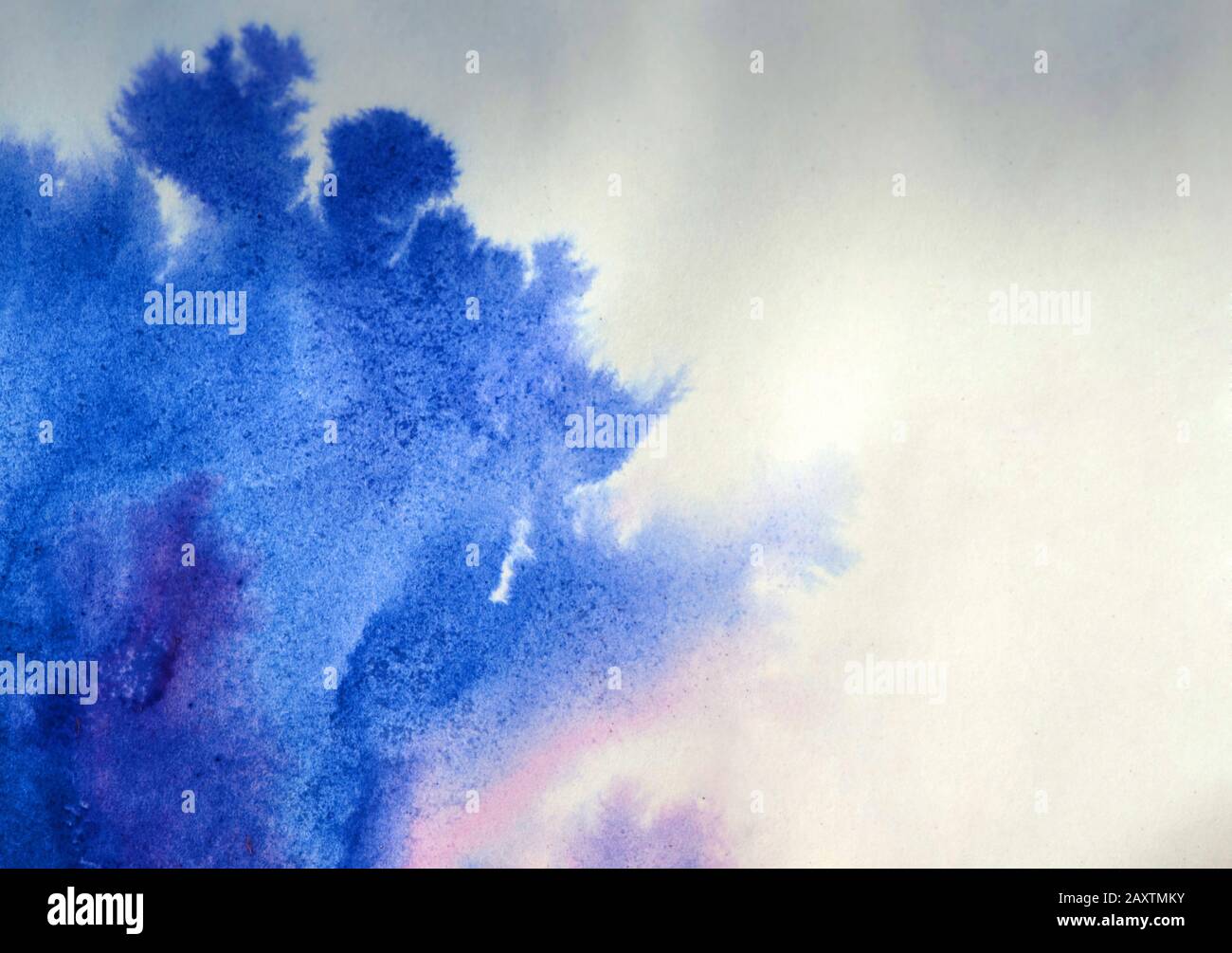 ink spot spreads on paper blue color Stock Photo - Alamy