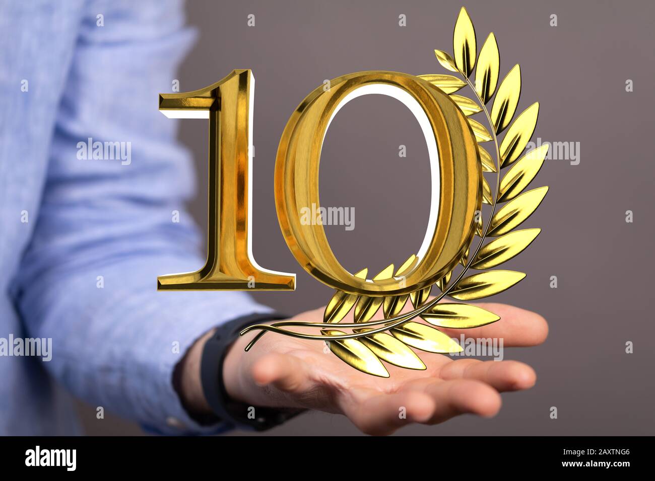 Golden number 10 and a spike of wheat over someone's hands Stock Photo ...