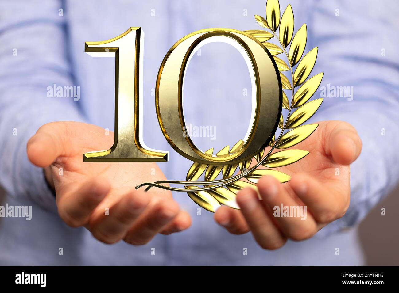 Golden number 10 and a spike of wheat over someone's hands Stock Photo ...
