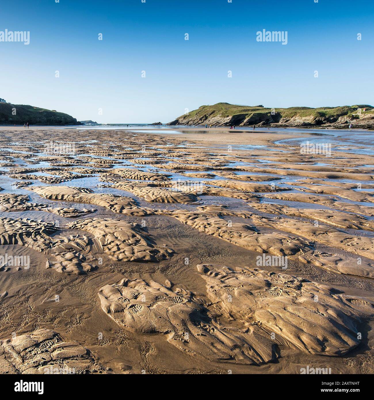 Low tide at Porth Beach in Newquay in Cornwall.Low tide at Porth Beach ...