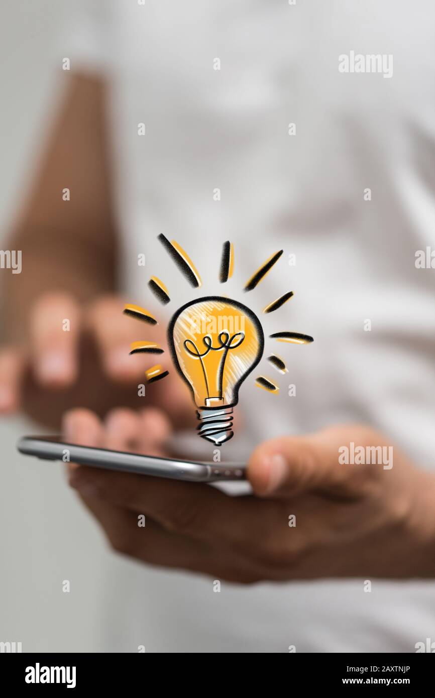 Sign of a glowing light bulb over someone's hand Stock Photo - Alamy