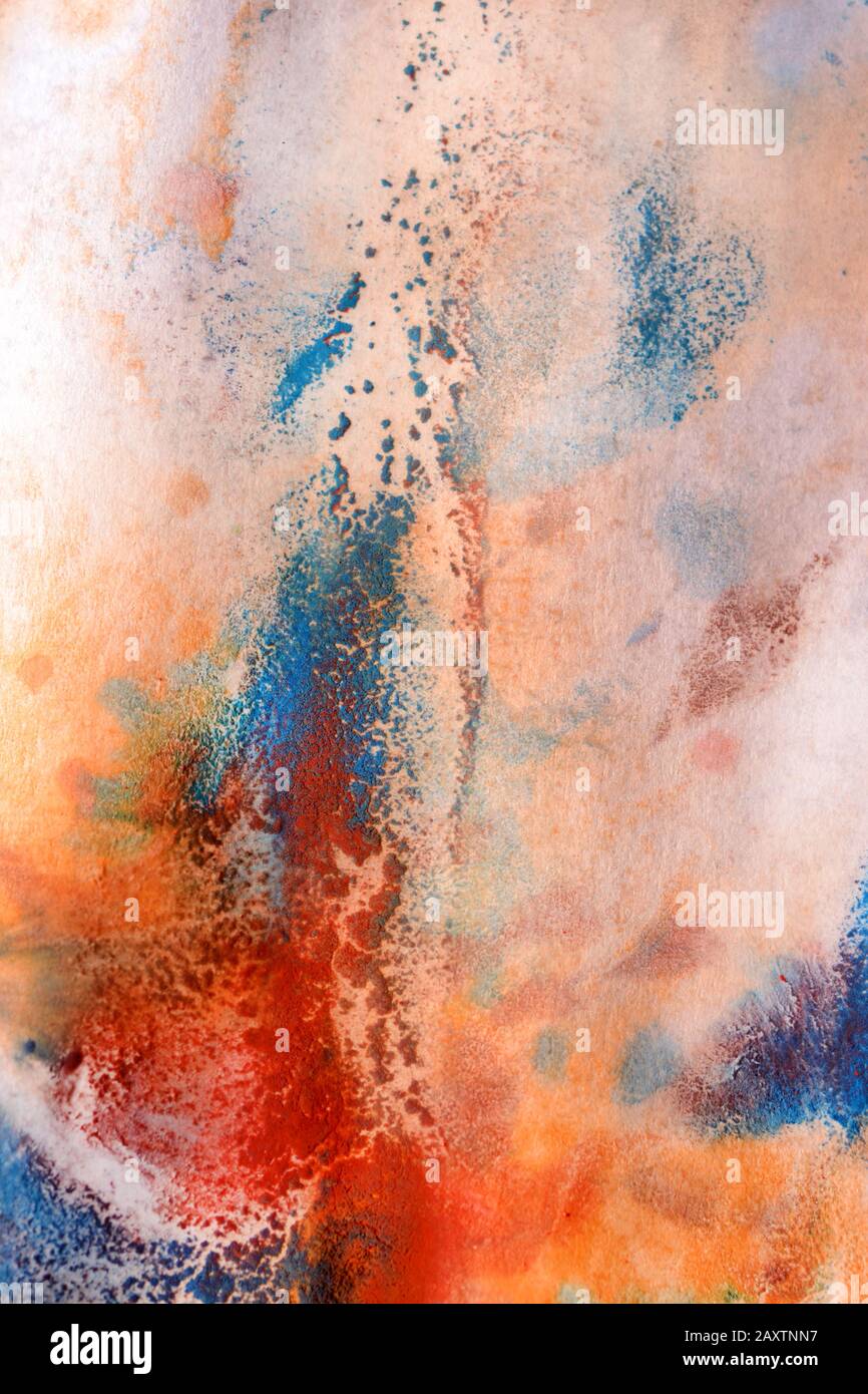 Mixing of paints of different colors on a white paper. Abstract ...
