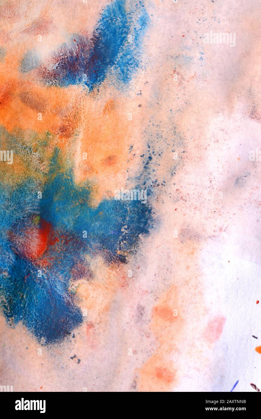 Mixing of paints of different colors on a white paper. Abstract ...
